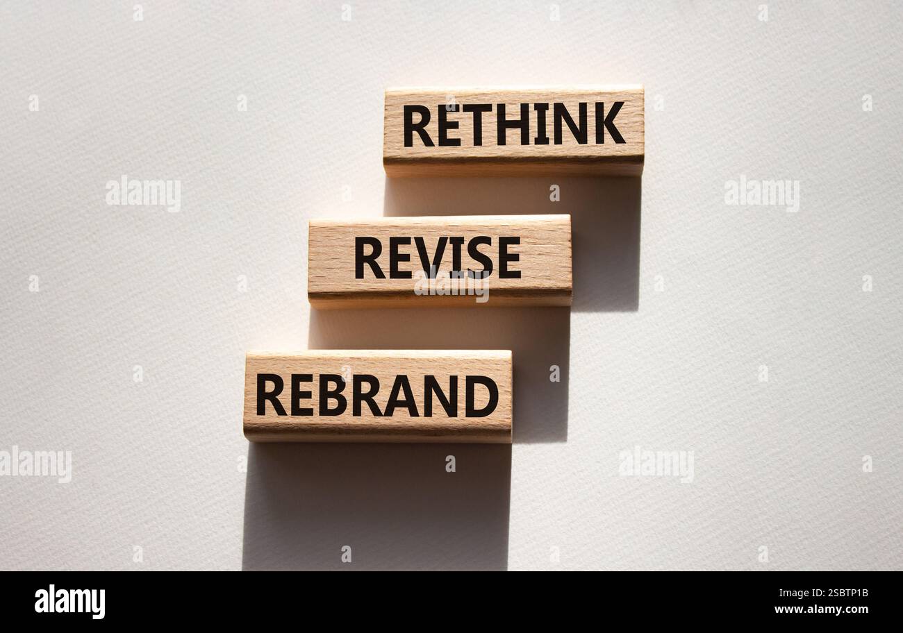 Rethink Revise Rebrand symbol. Wooden blocks with words Rethink Revise Rebrand. Beautiful white ...