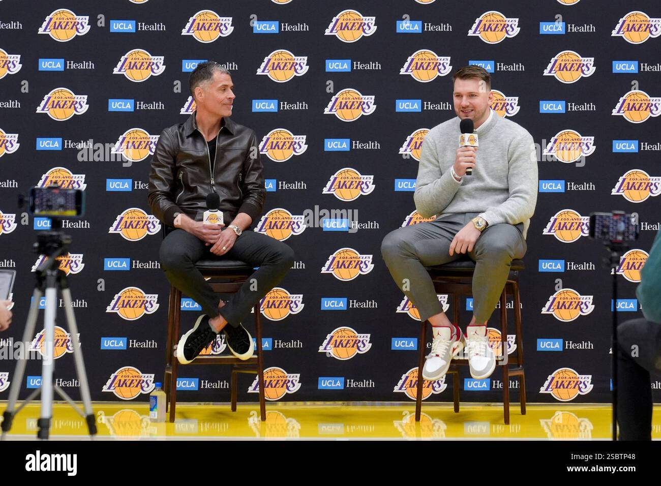 Los Angeles Lakers' Luka Doncic speaks next to general manager Rob ...
