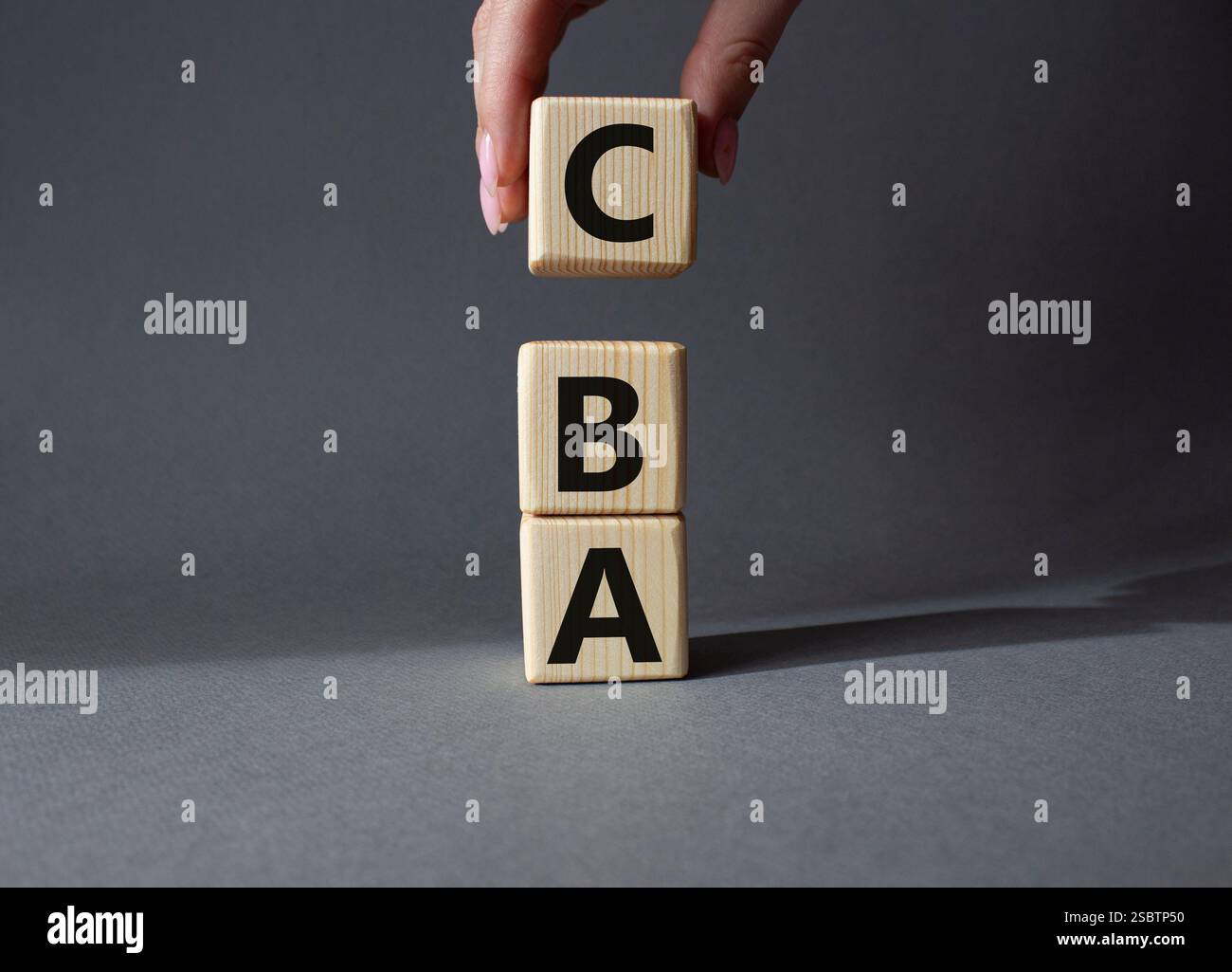 CBA - Cost Benefit Analysis symbol. Wooden cubes with word CBA ...