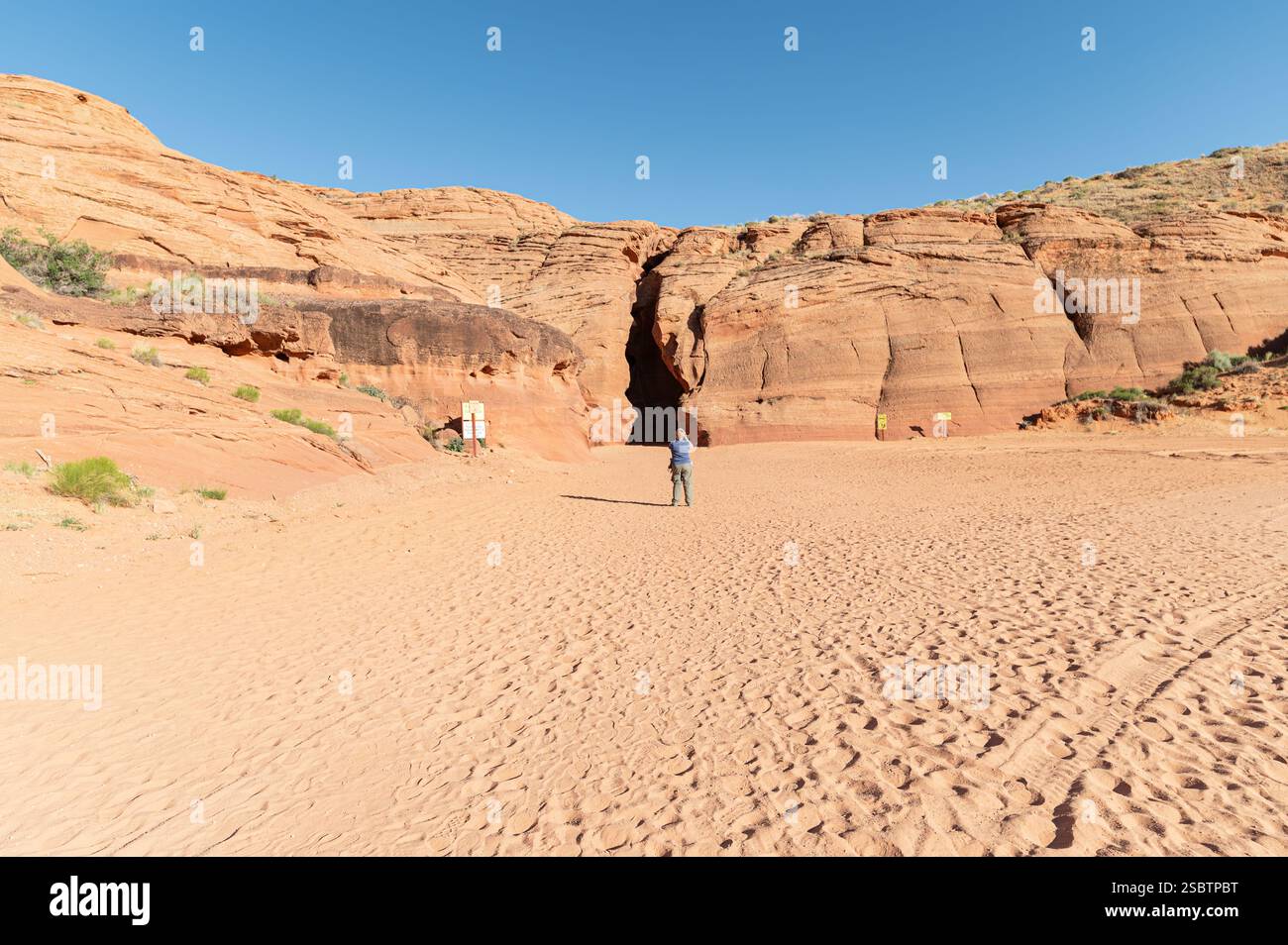 Photographer (unrecognizable) at the entrance of Navajo Upper Antelope ...