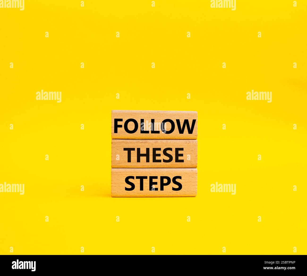 Follow these steps symbol. Wooden blocks with words Follow these steps ...