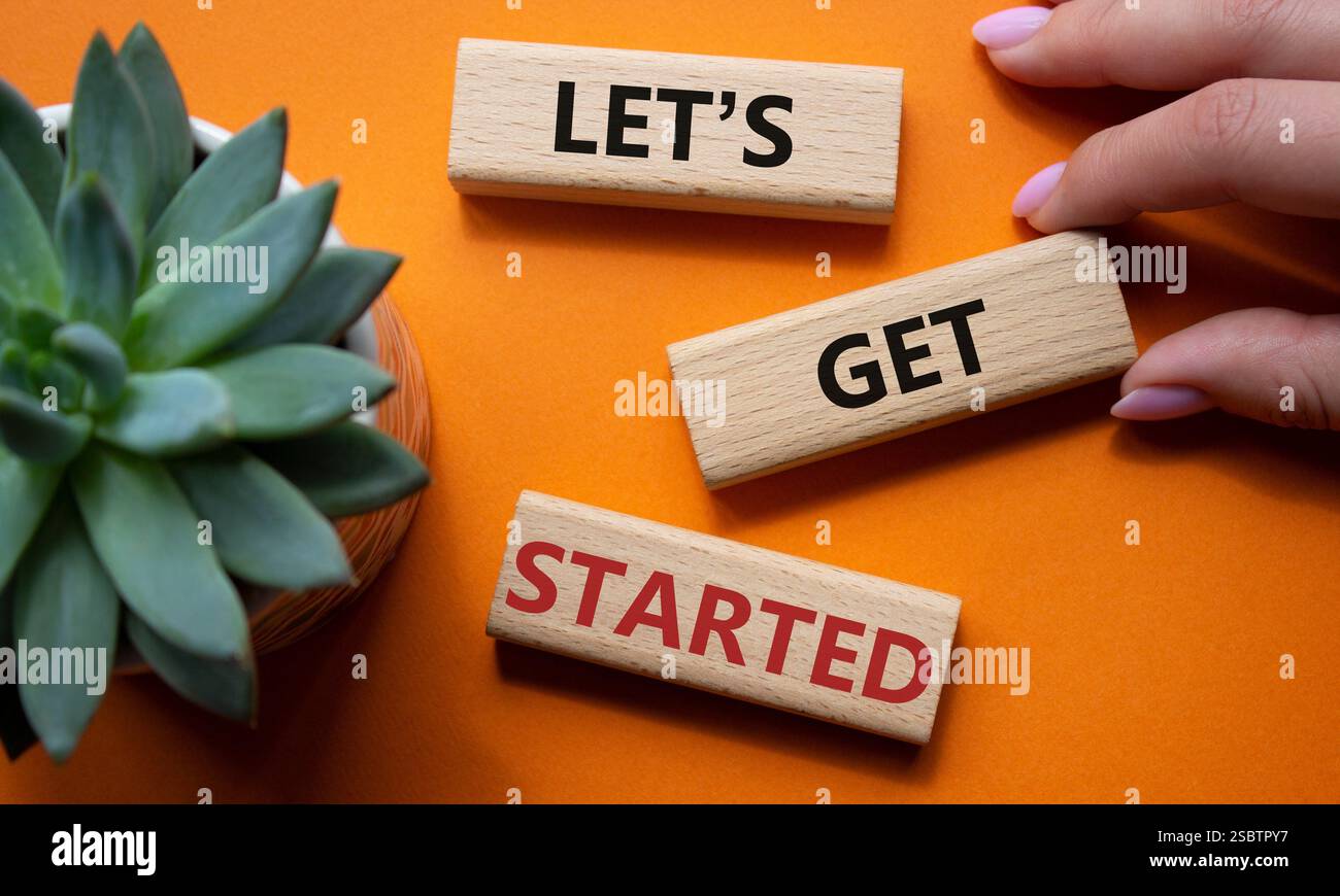 Lets get started symbol. Concept words Lets get started on wooden ...