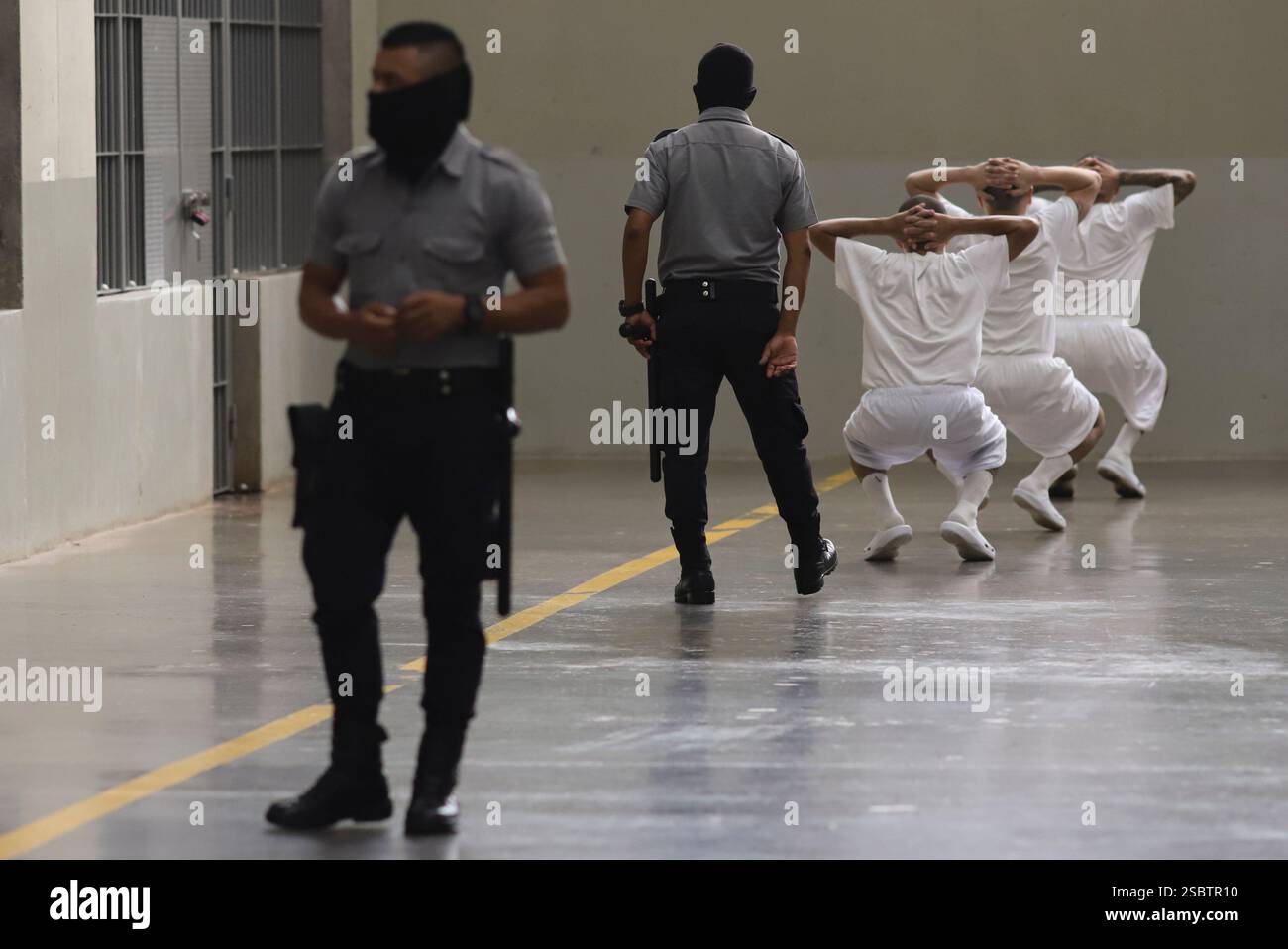 FILE - Inmates exercise under the watch of prison guards during a press ...