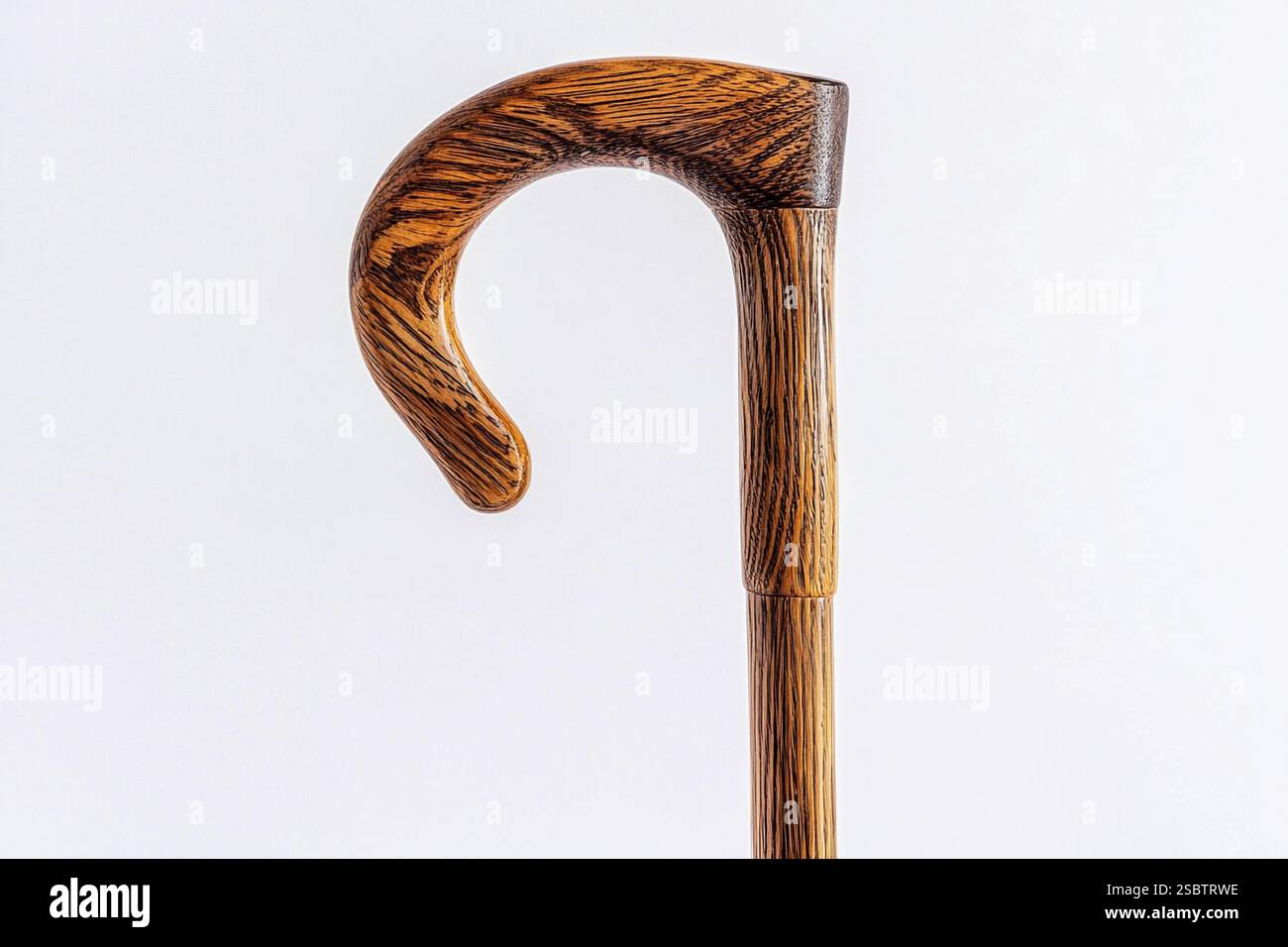 A beautifully crafted wooden walking cane shows off its elegant hook ...