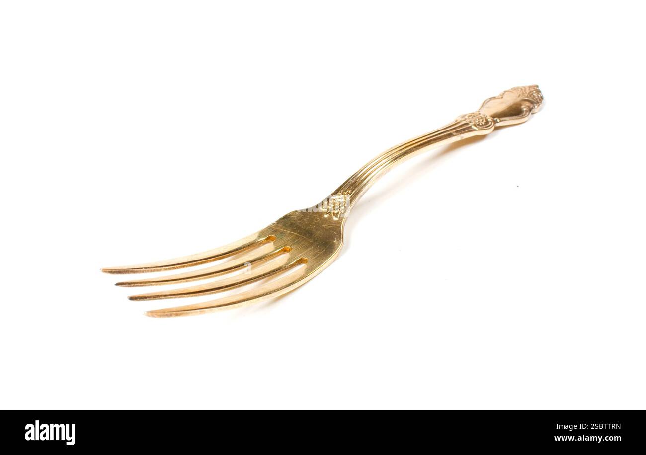 Golden fork isolated on white background Stock Photo - Alamy