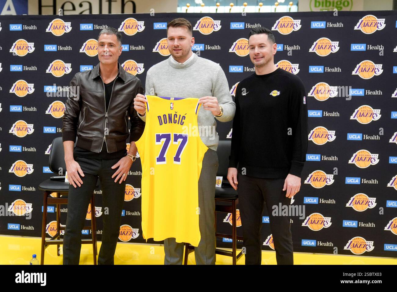 From left to right, Los Angeles Lakers general manager Rob Pelinka, Luka Doncic, and head coach ...