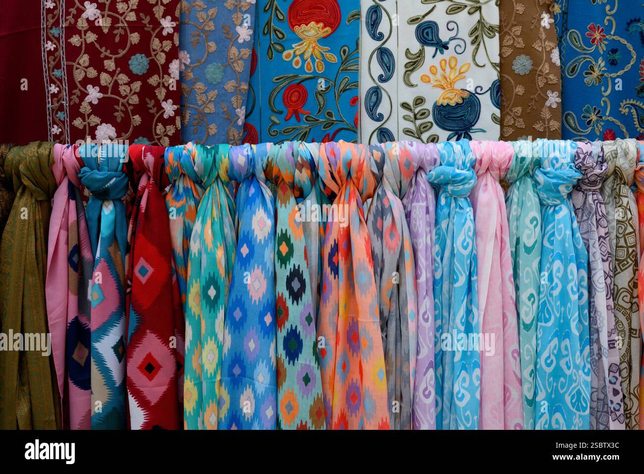 Palette of colors and patterns of national Uzbek fabrics in Samarkand ...