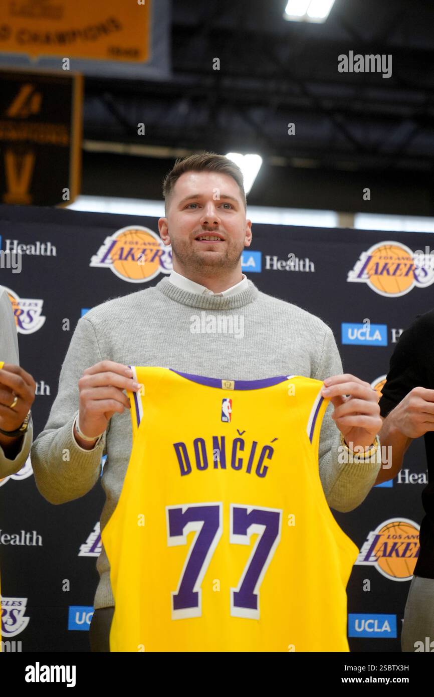 Los Angeles Lakers' Luka Doncic poses for photos with his new jersey during an introductory NBA ...
