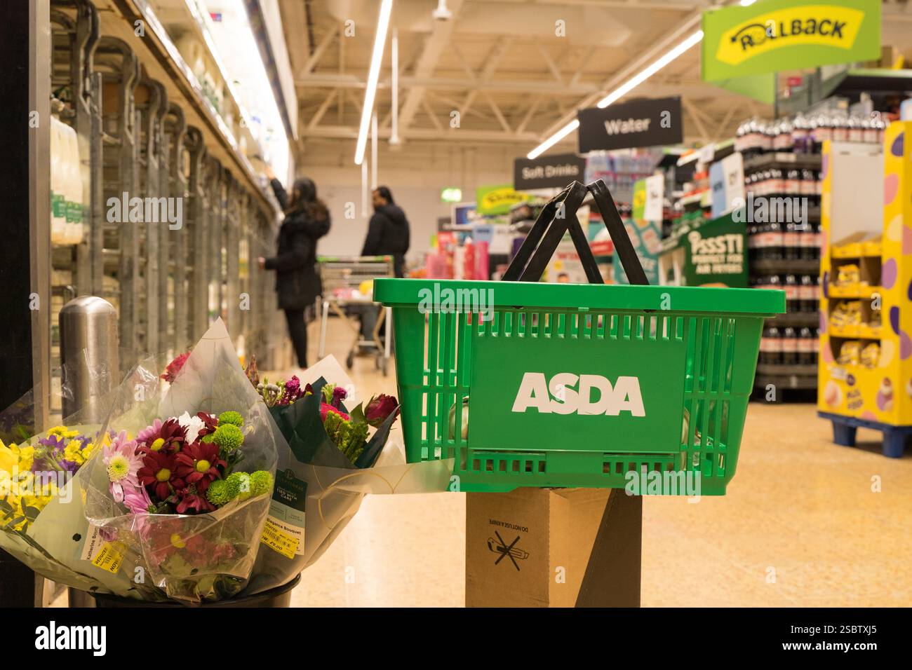 ASDA shopping basket in the middle of dairy product aisle filled with ...