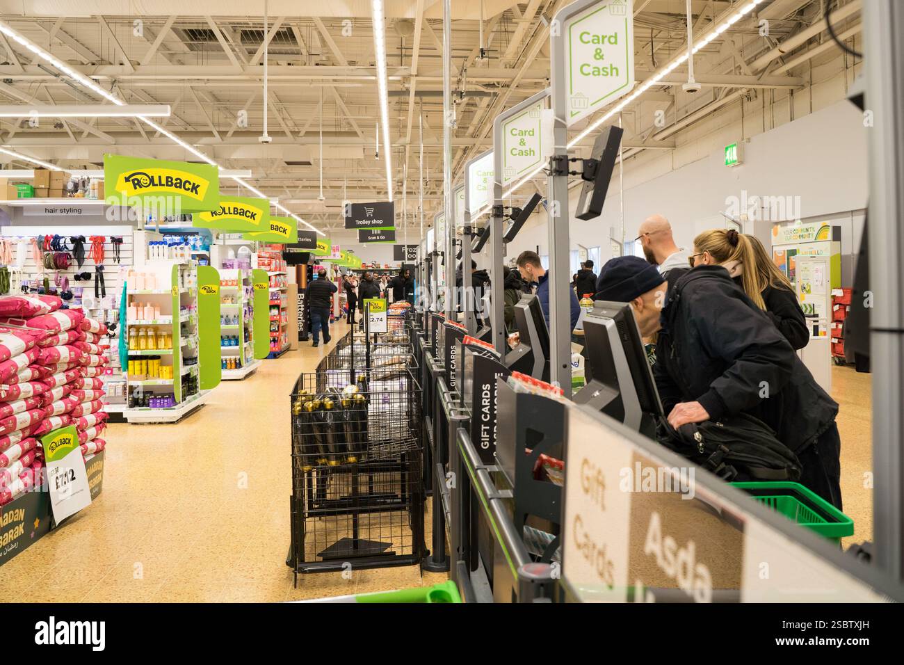 Customers checking out at automated tills at ASDA supermarket England ...