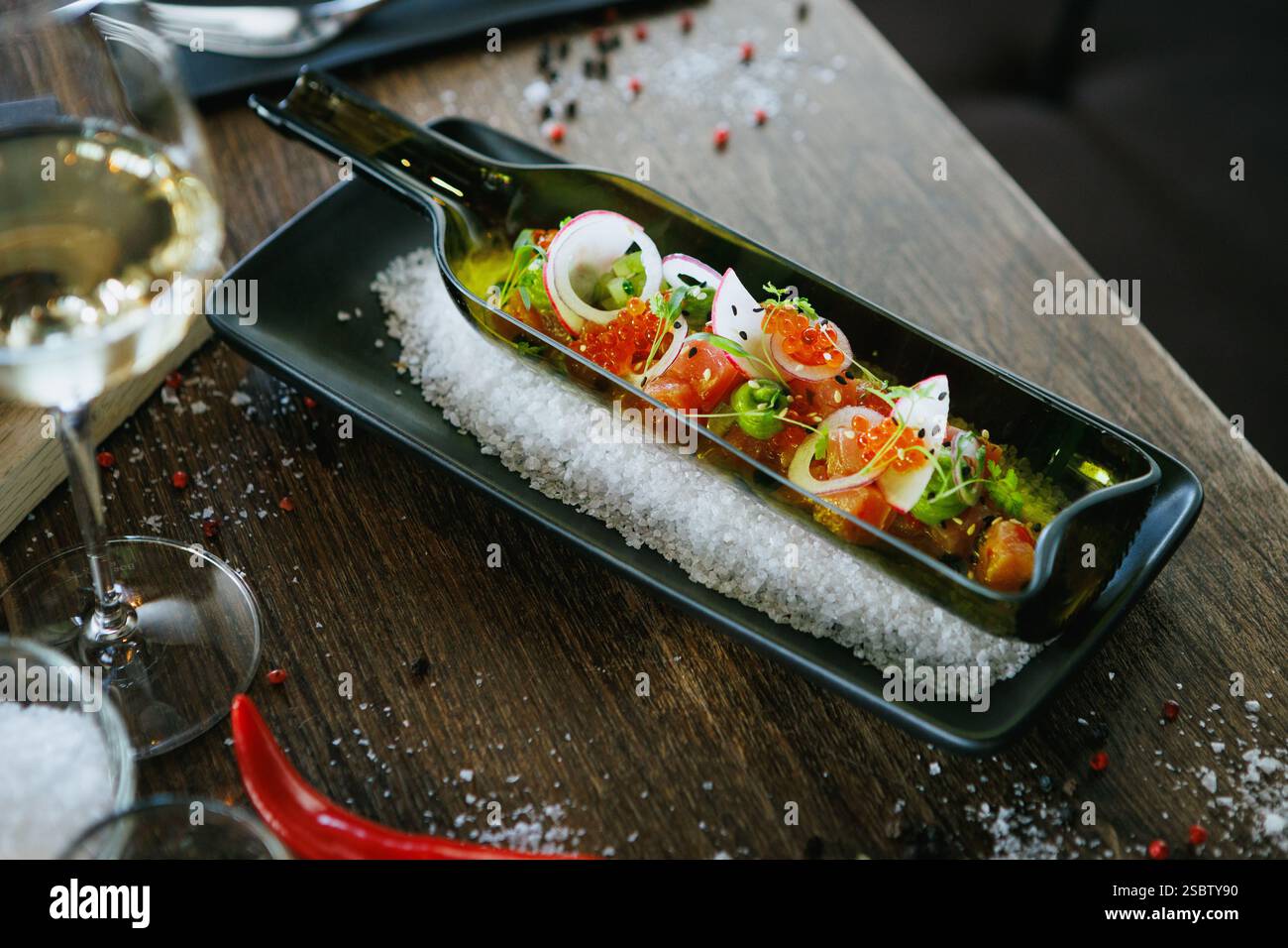 Tuna tartare with avocado, radish, and salmon roe. Garnished with ...