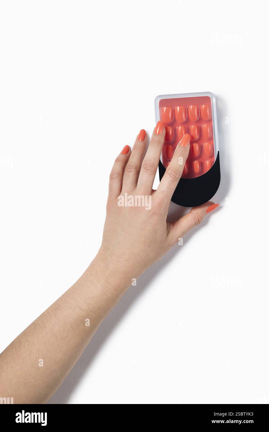 woman hand with false nails after nail salon on a white background ...