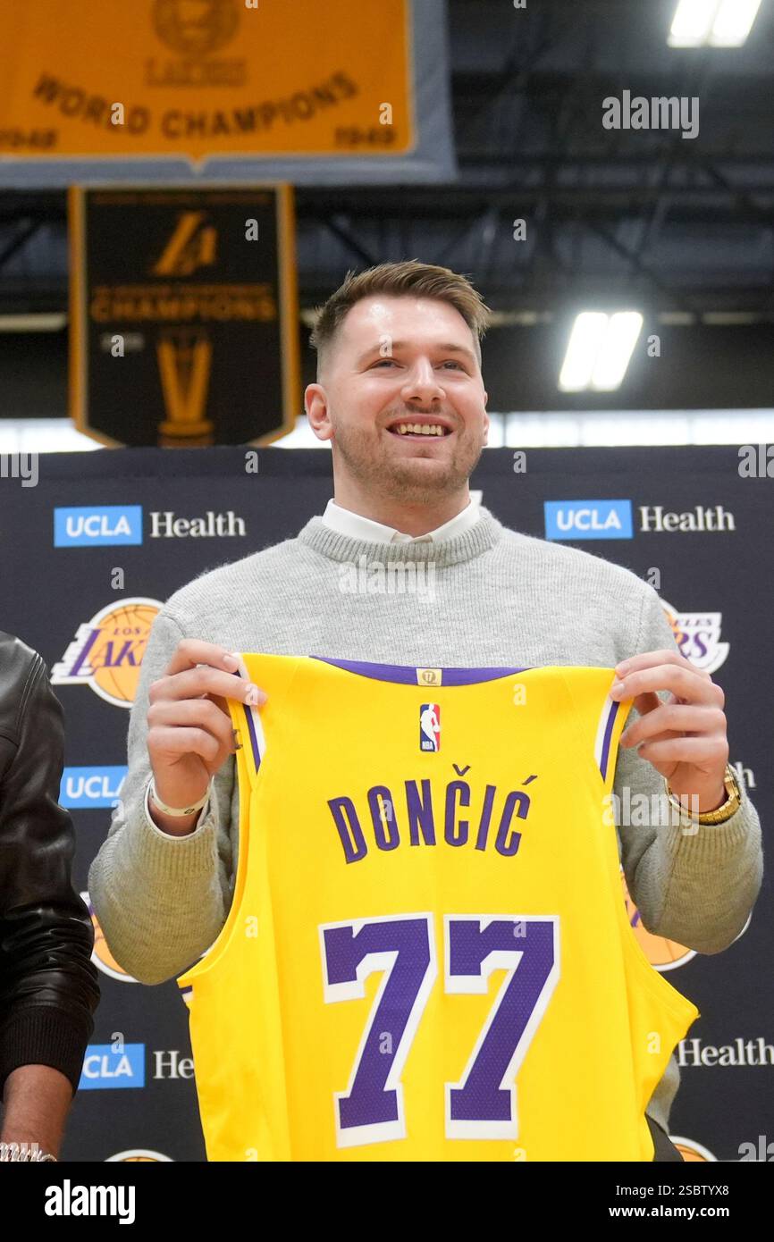 Los Angeles Lakers' Luka Doncic poses for photos with his new jersey ...