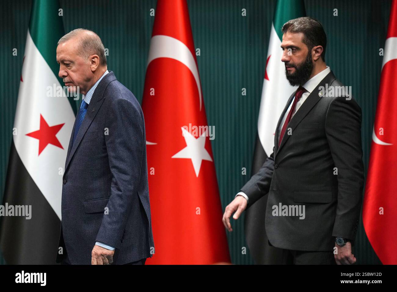 Turkish President Recep Tayyip Erdogan, left, and Syria's interim ...