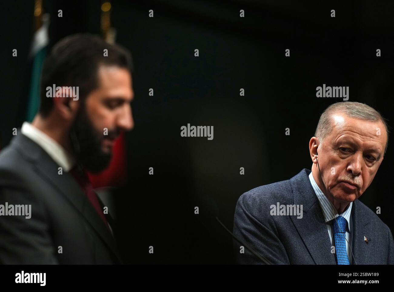 Turkish President Recep Tayyip Erdogan, right, listens to Syria's ...
