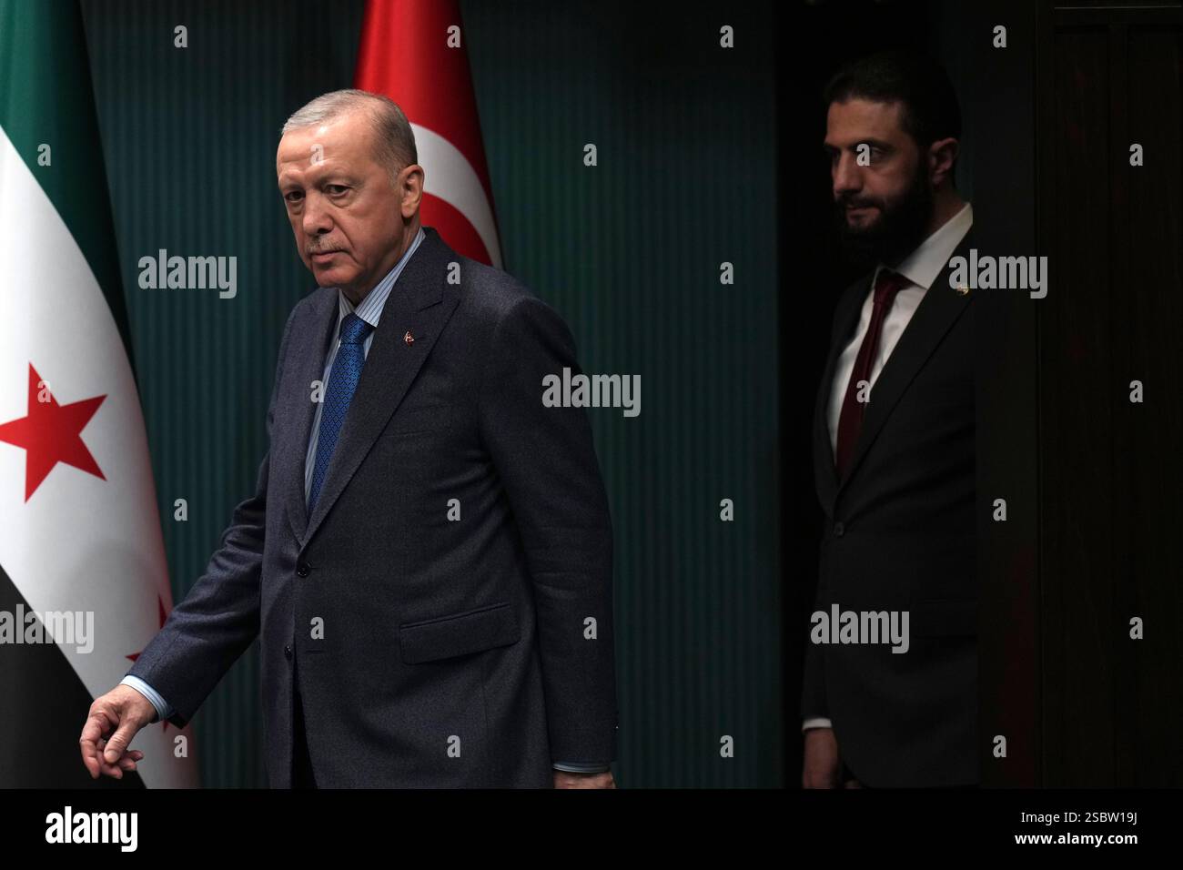 Turkish President Recep Tayyip Erdogan, left, and Syria's interim ...