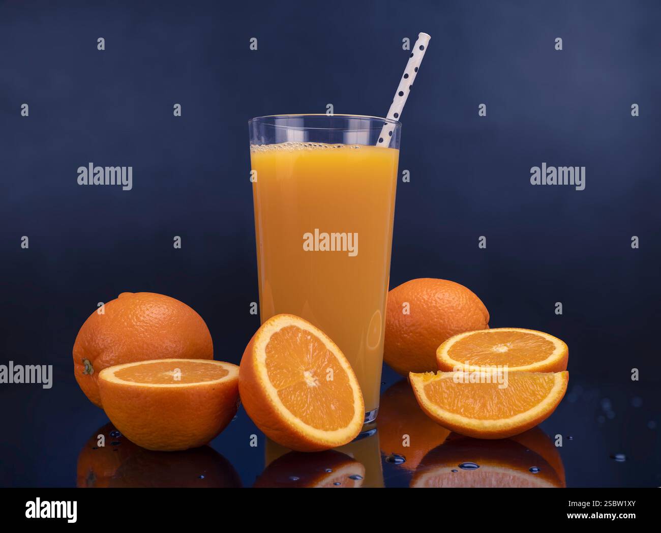 Fresh orange juice into glass for breakfast. Orange juice contains ...