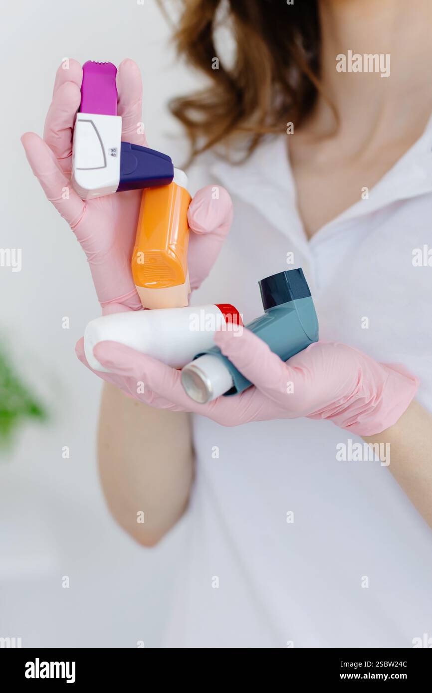 Female doctor holding and showing asthma inhaler. Medical portable ...