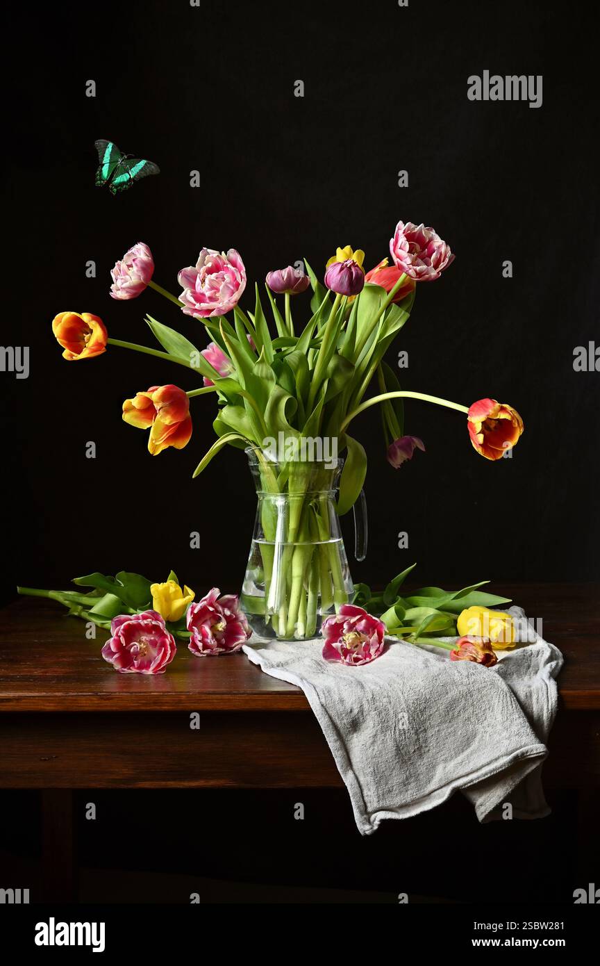 Photo still life in Dutch style with colourful tulips and a butterfly ...