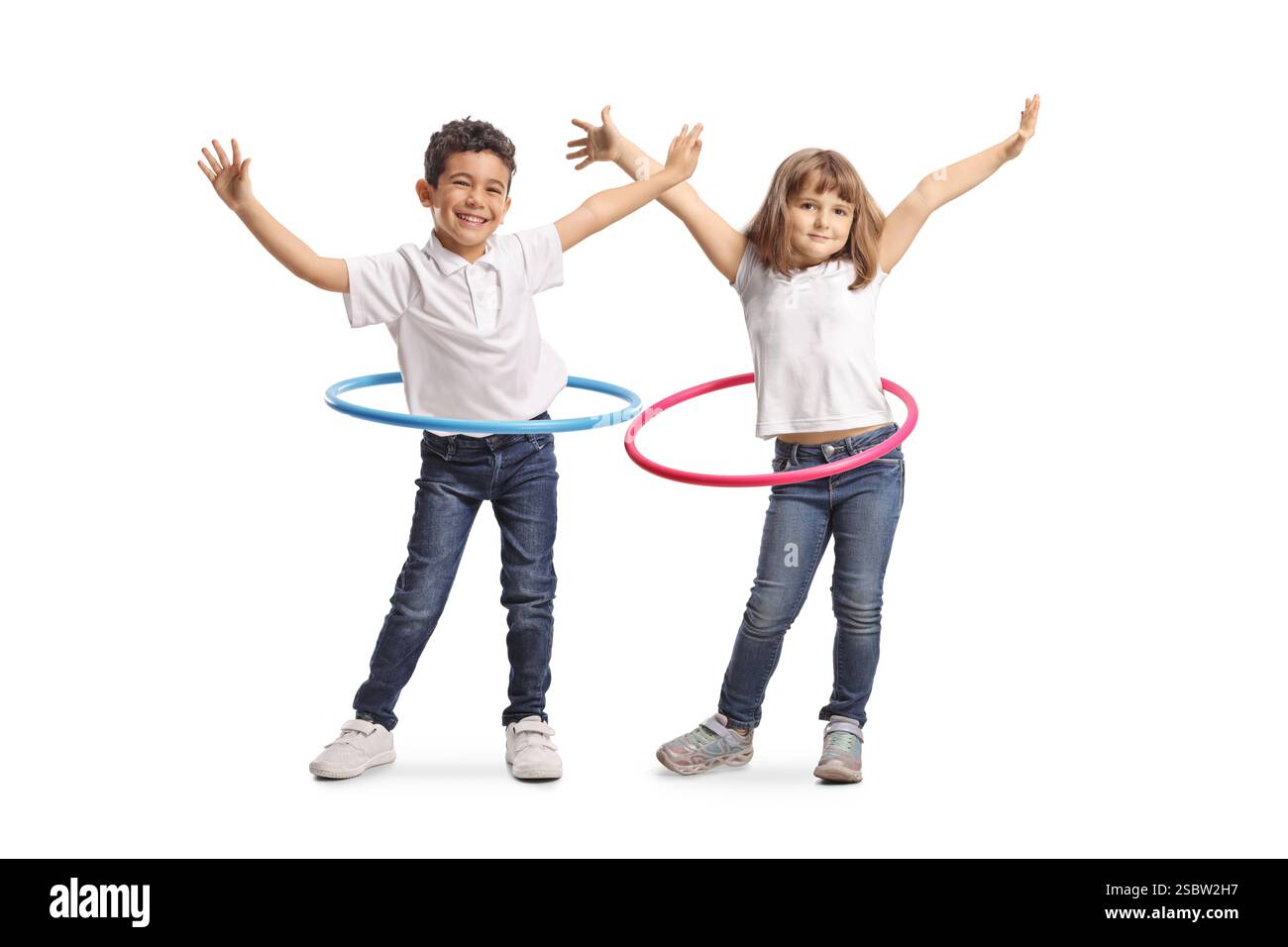 Cute little boy and girl spinning a hula hoops isolated on white ...