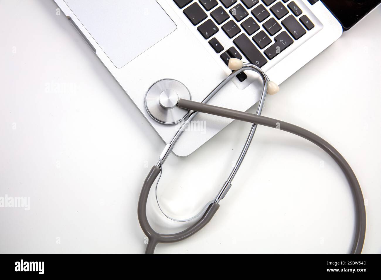 Telemedicine, medical stethoscope and computer laptop on white, top ...