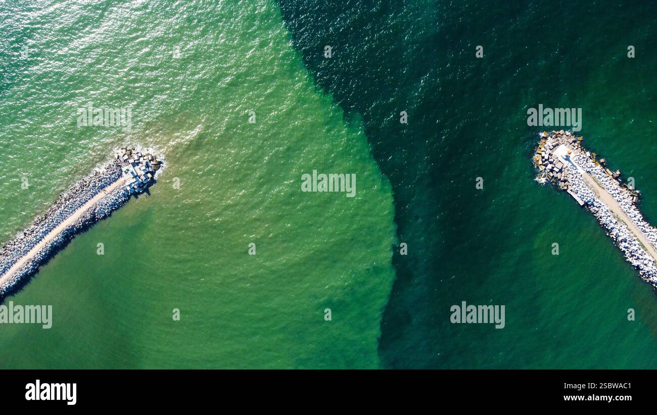 Aerial View of Two Rocky Piers Dividing Waters Stock Photo - Alamy