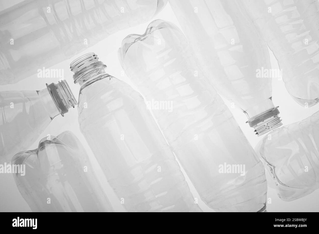 Empty plastic bottles on white background, top view Stock Photo - Alamy