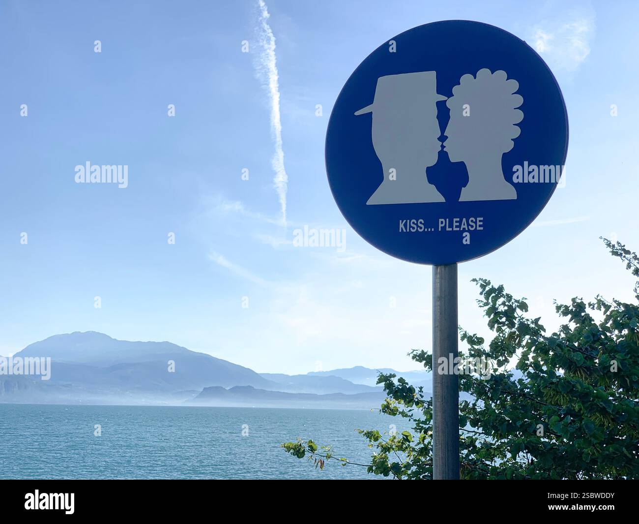 Sirmione, Italy: May 31, 2019: Outdoor sign Kiss Please with Lake Garda ...
