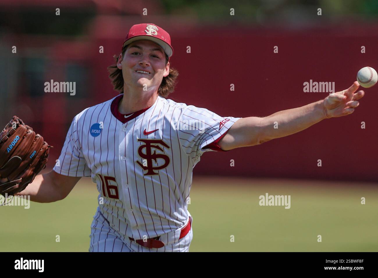 FILE - Florida State pitcher Jamie Arnold (16) warms up before an NCAA ...