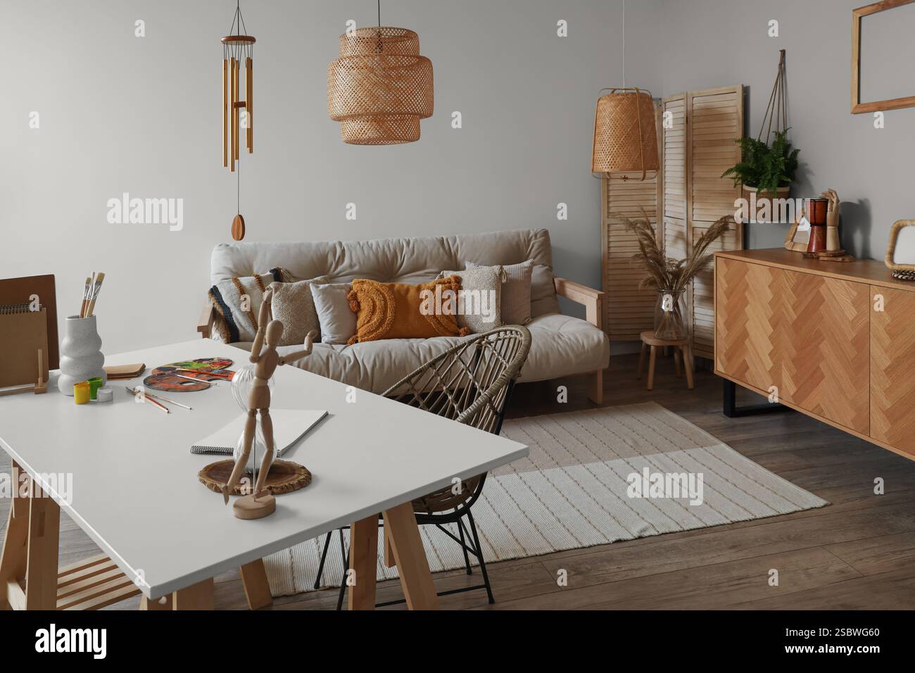 Interior of light room with wind chime and artist's workplace Stock ...