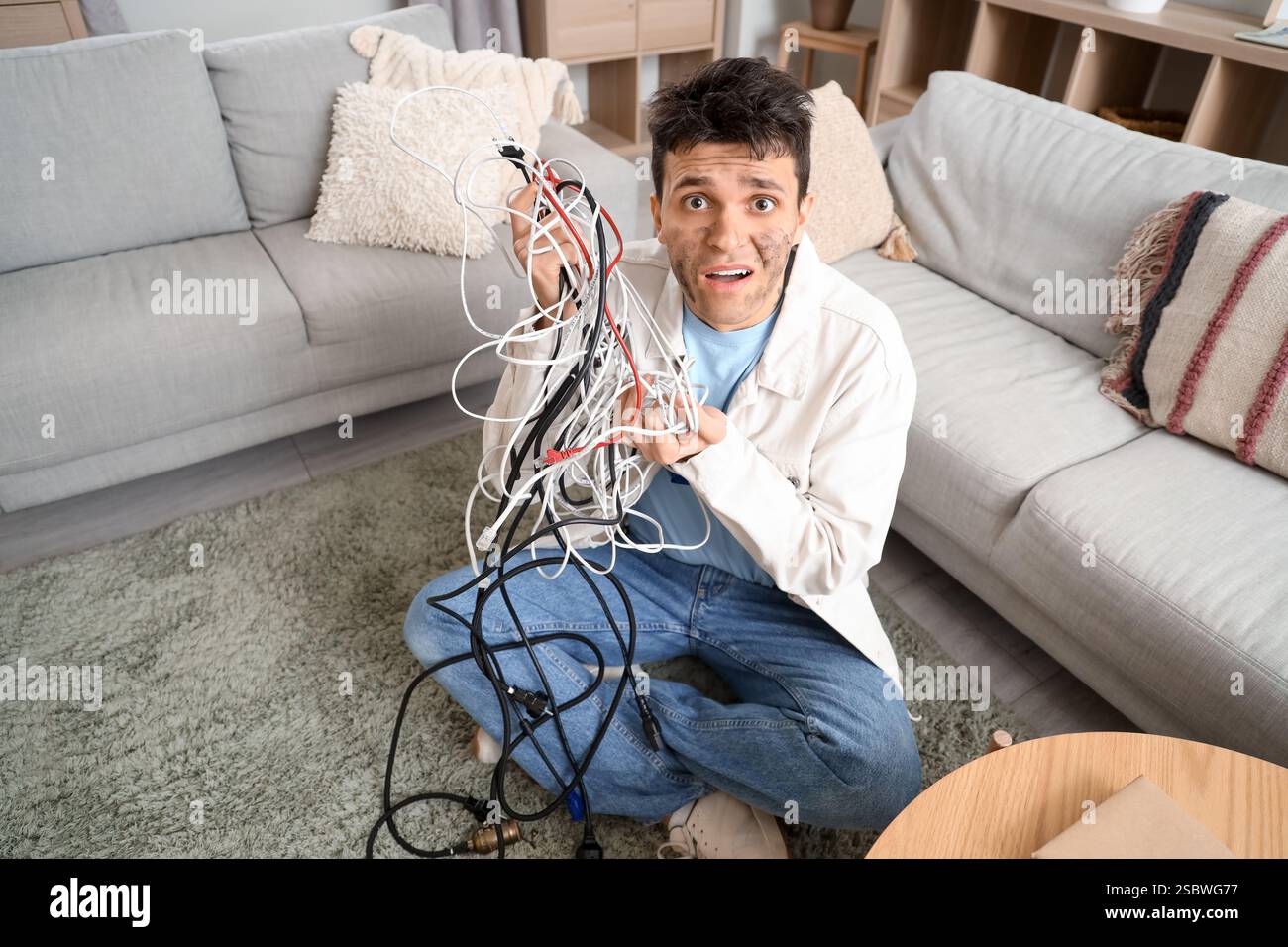 Electrocuted man with burnt face and wires at home Stock Photo - Alamy