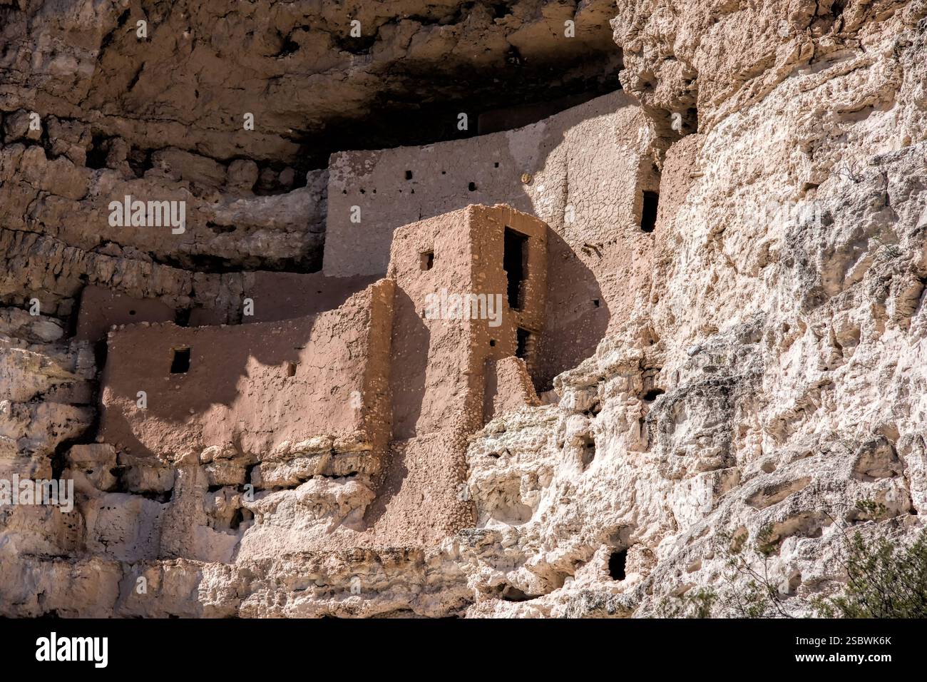 A building is on a rock. The building is brown. The rock is white Stock ...