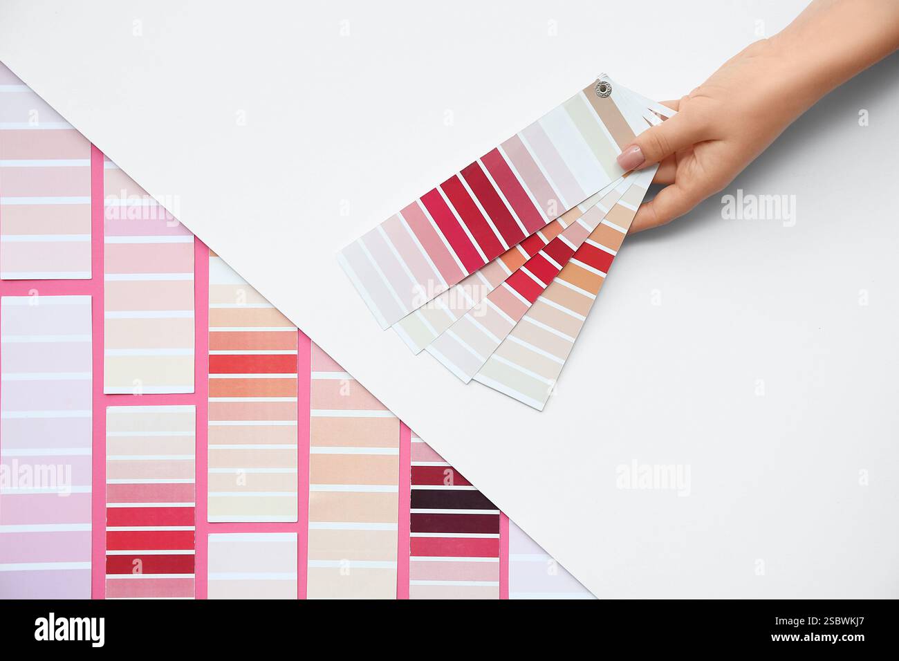 Female hand with different paint color palettes on light background ...