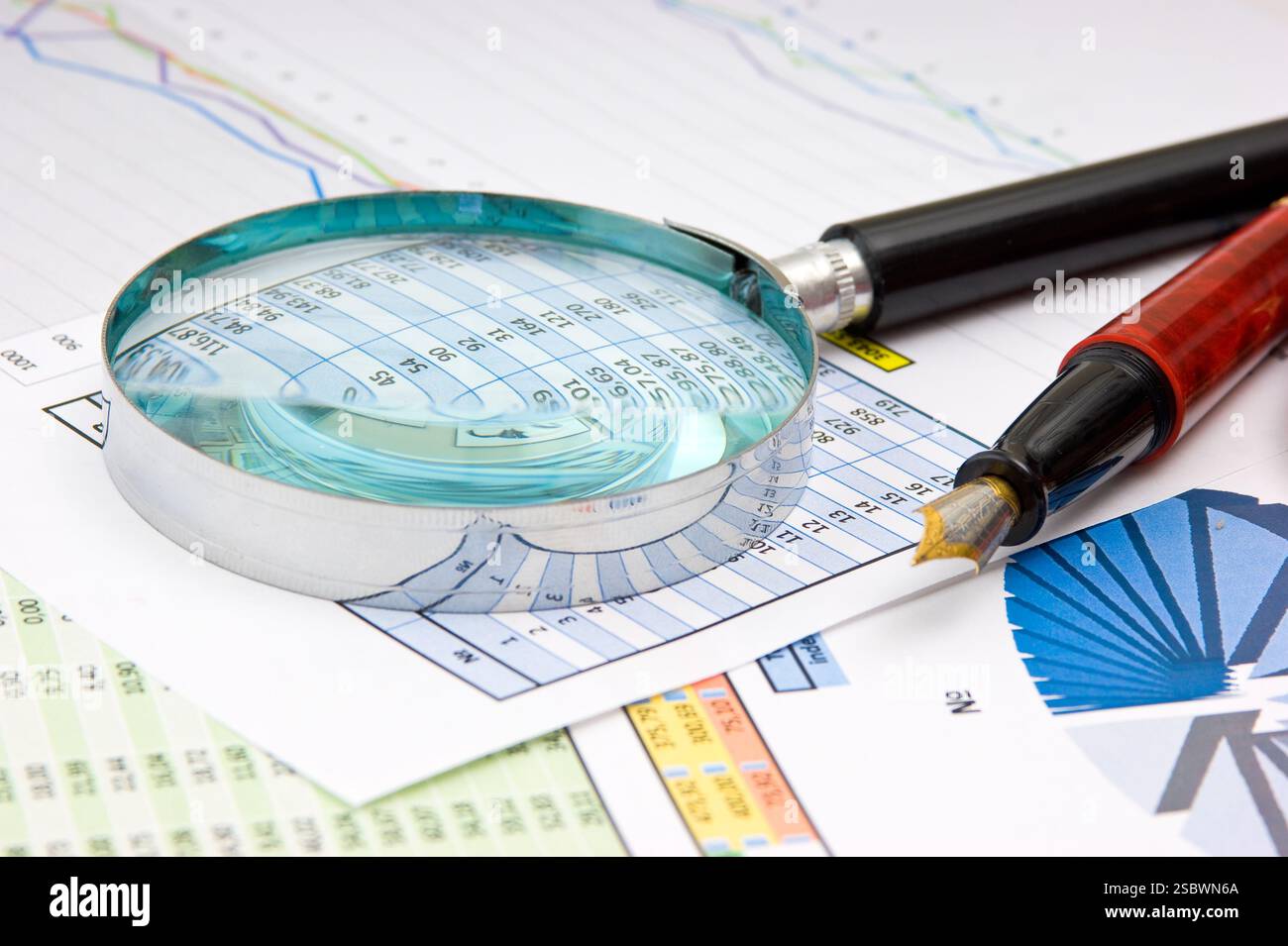 Graphs tables and documents laid on the table Stock Photo - Alamy