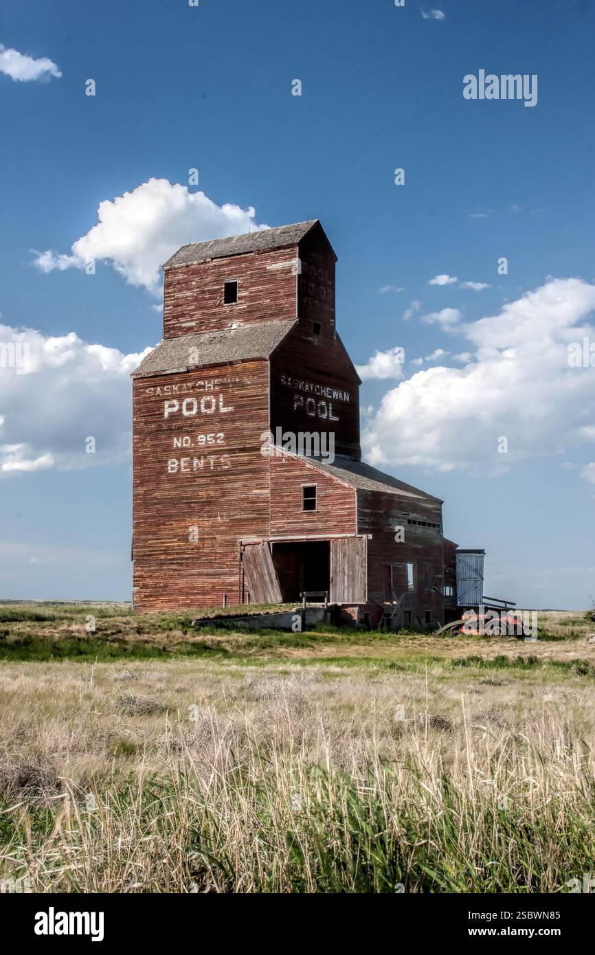 A red grain silo with the word POOL on it. The silo is empty. The sky ...