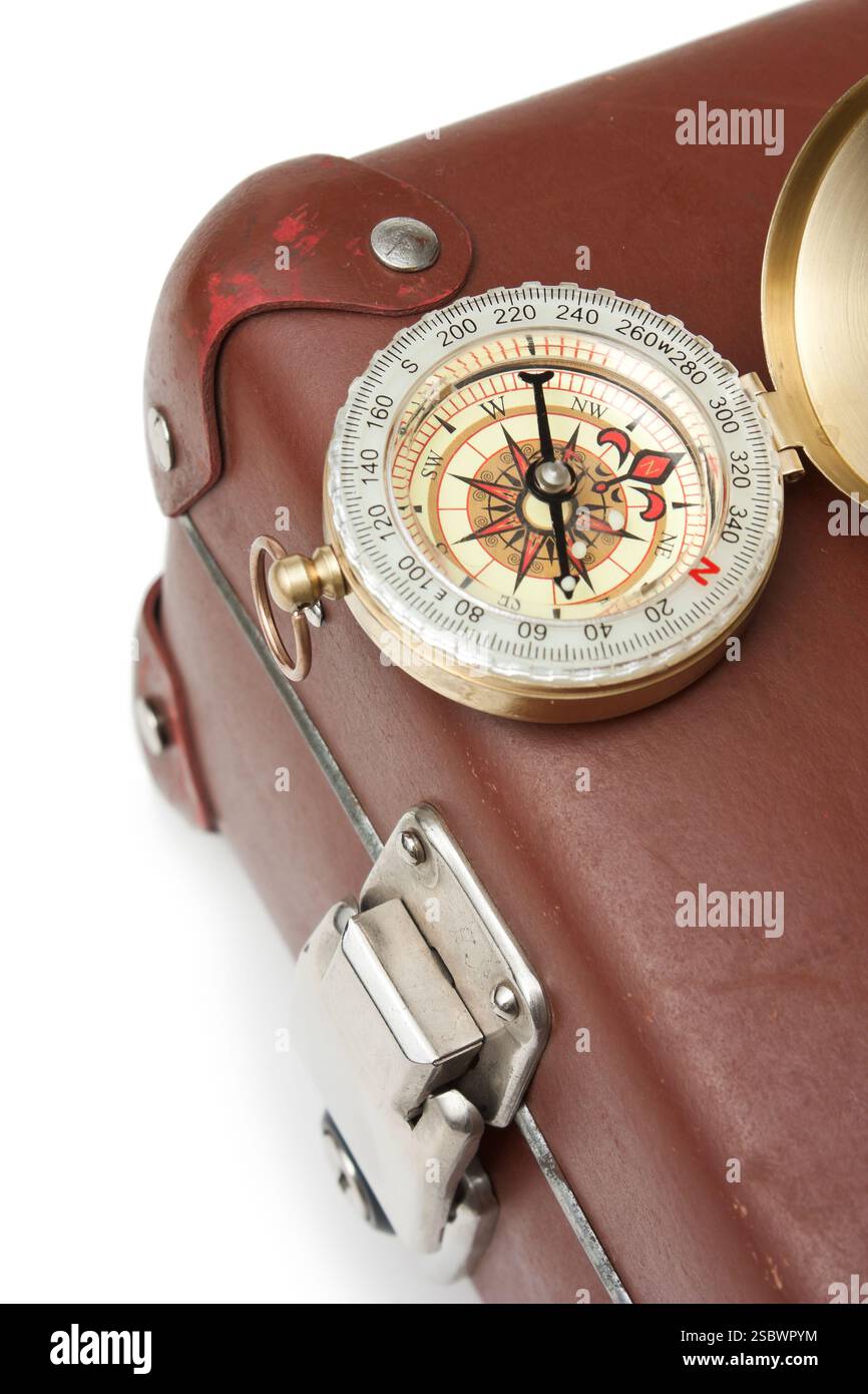 old suitcase with a compass isolate on a white background Stock Photo ...