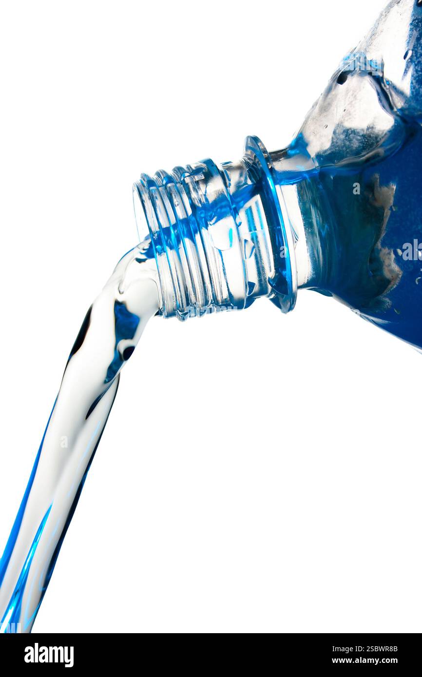 stream of water flows from the bottle Isolated on white background ...