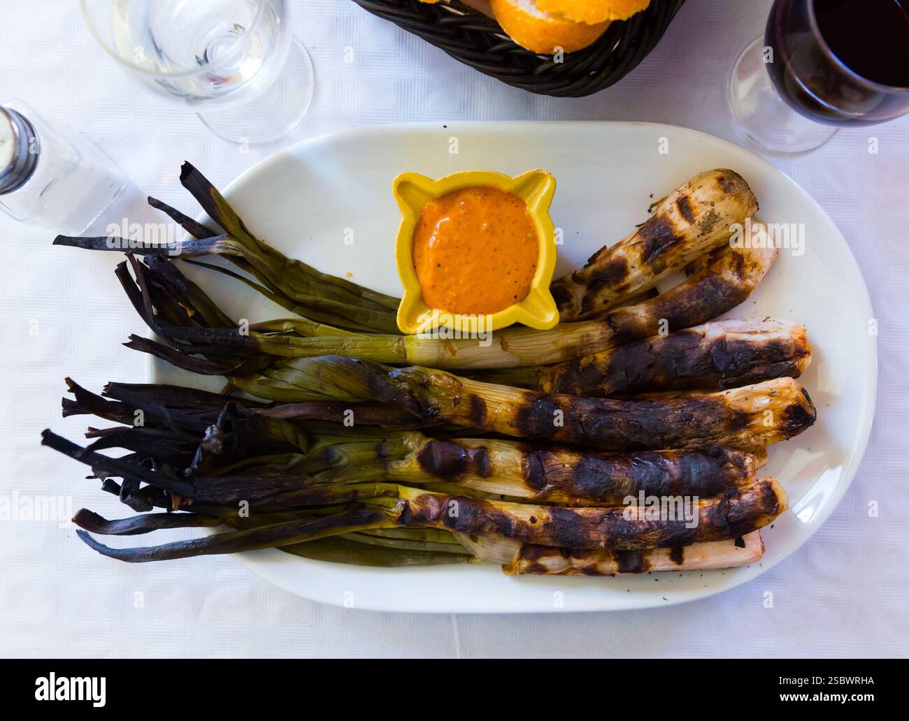 Calcots onions with Romesco sauce Stock Photo - Alamy