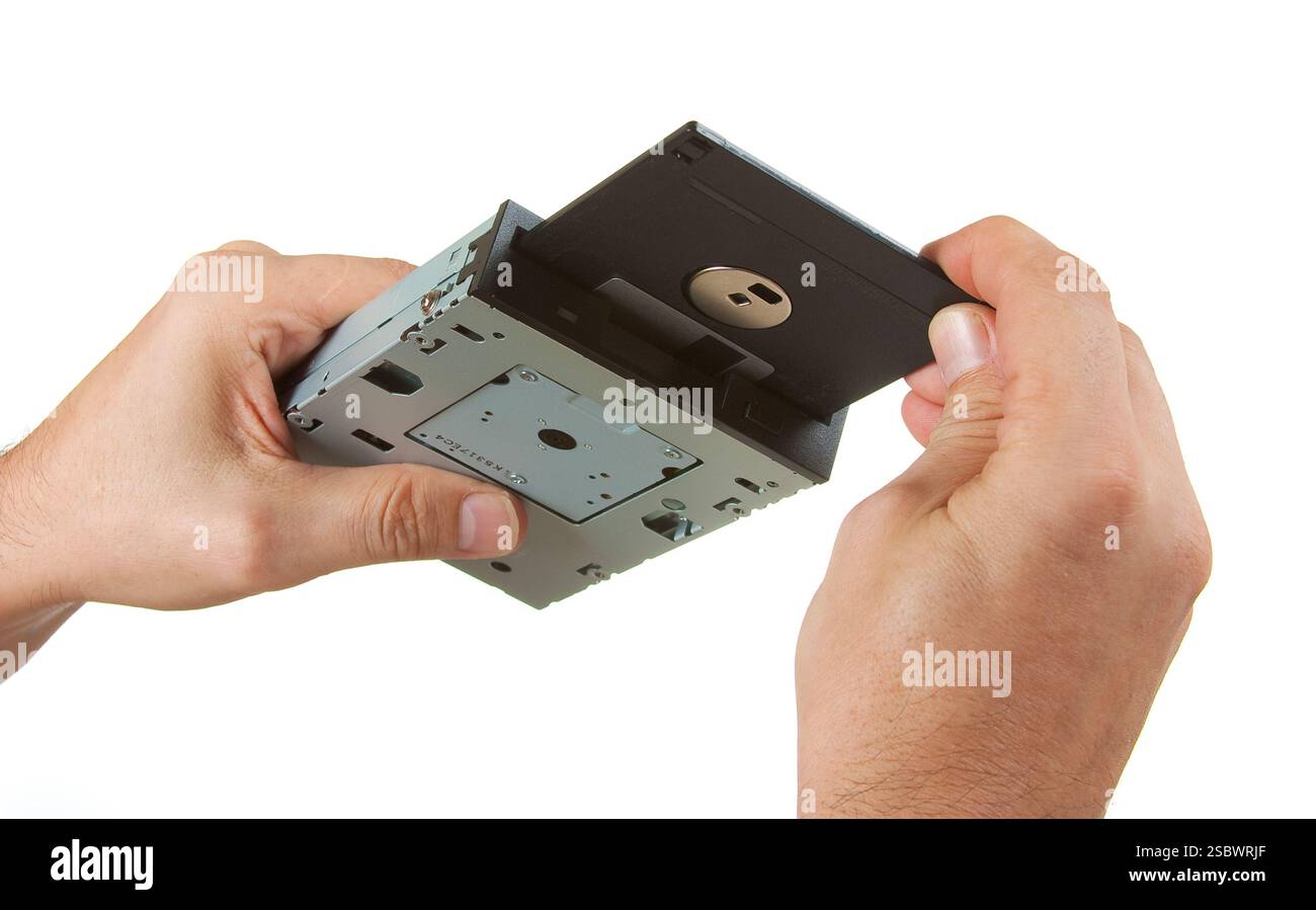 floppy disk drive in hand isolated on white background Stock Photo - Alamy