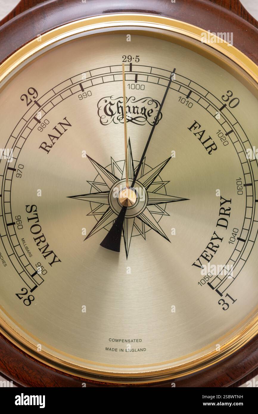 Close up of an aneroid barometer mounted on a wall Stock Photo - Alamy