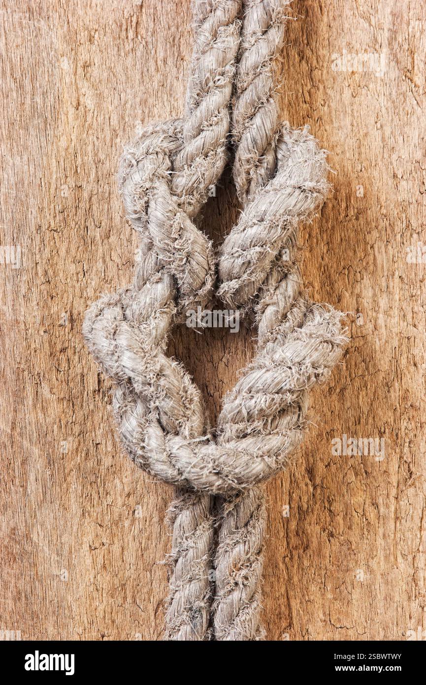 Rope with knots on the background of the old wooden boards Stock Photo ...