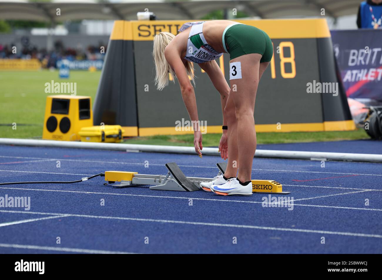 Keely HODGKINSON of Leigh Harriers checking her starting blocks prior ...