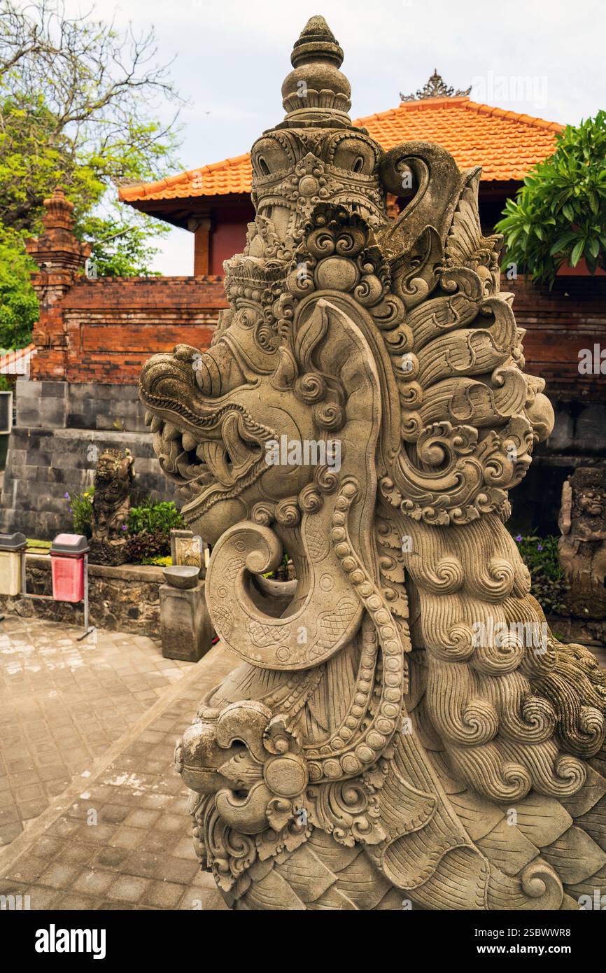 A detailed stone sculpture of a mythical creature in Bali, showcasing ...