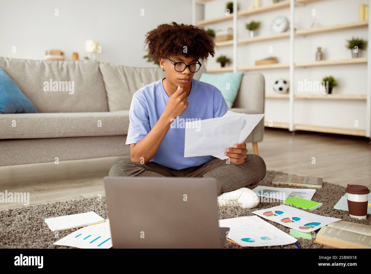 Domestic education concept. Black teen student making study project for ...