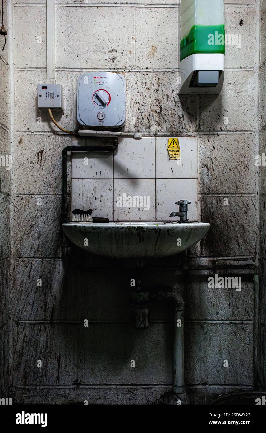 Very dirty abandoned industrial sink Stock Photo - Alamy