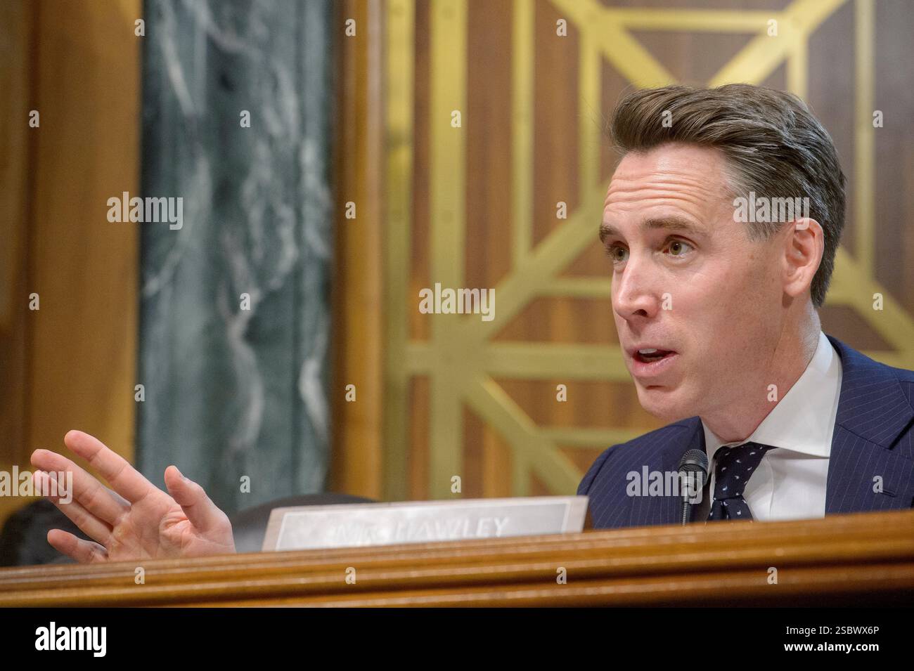 Sen. Josh Hawley, R-Mo., questions the witnesses during a Senate ...