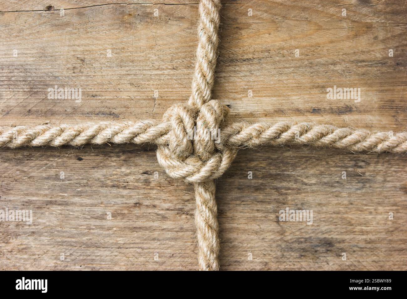 Rope with knots on the background of the old wooden boards Stock Photo ...