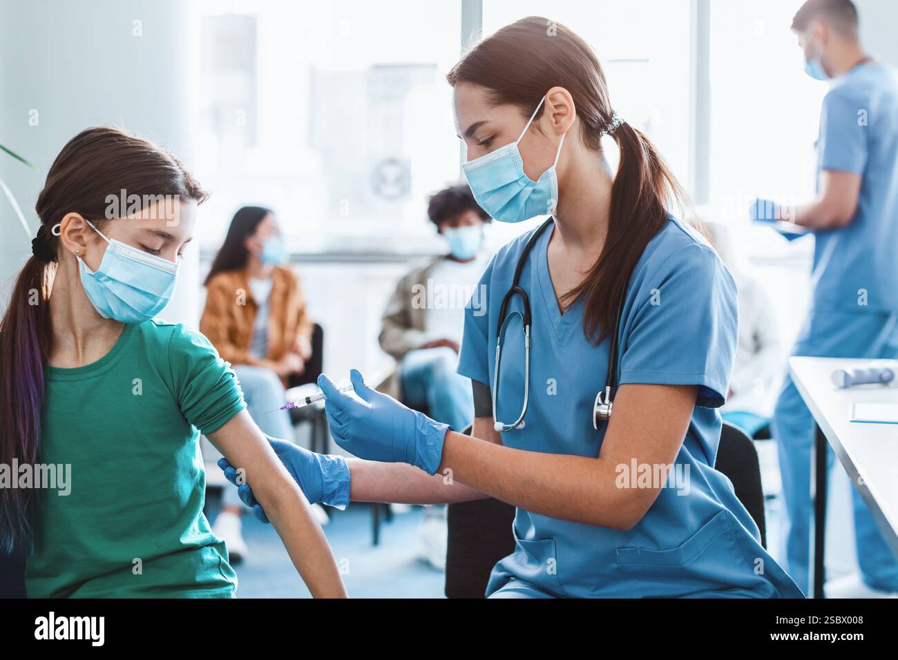 Girl Receiving Vaccine Injection Sitting With Doctor Indoor Stock Photo ...