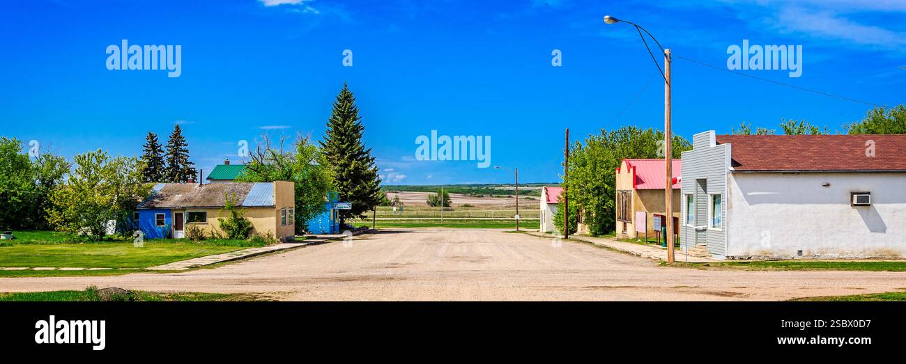 Small town with a few houses and a street. The houses are blue and ...