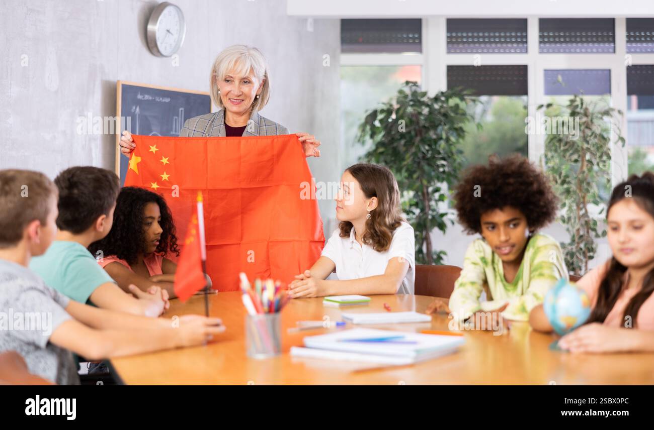 Mature woman teacher tells hi-res stock photography and images - Alamy